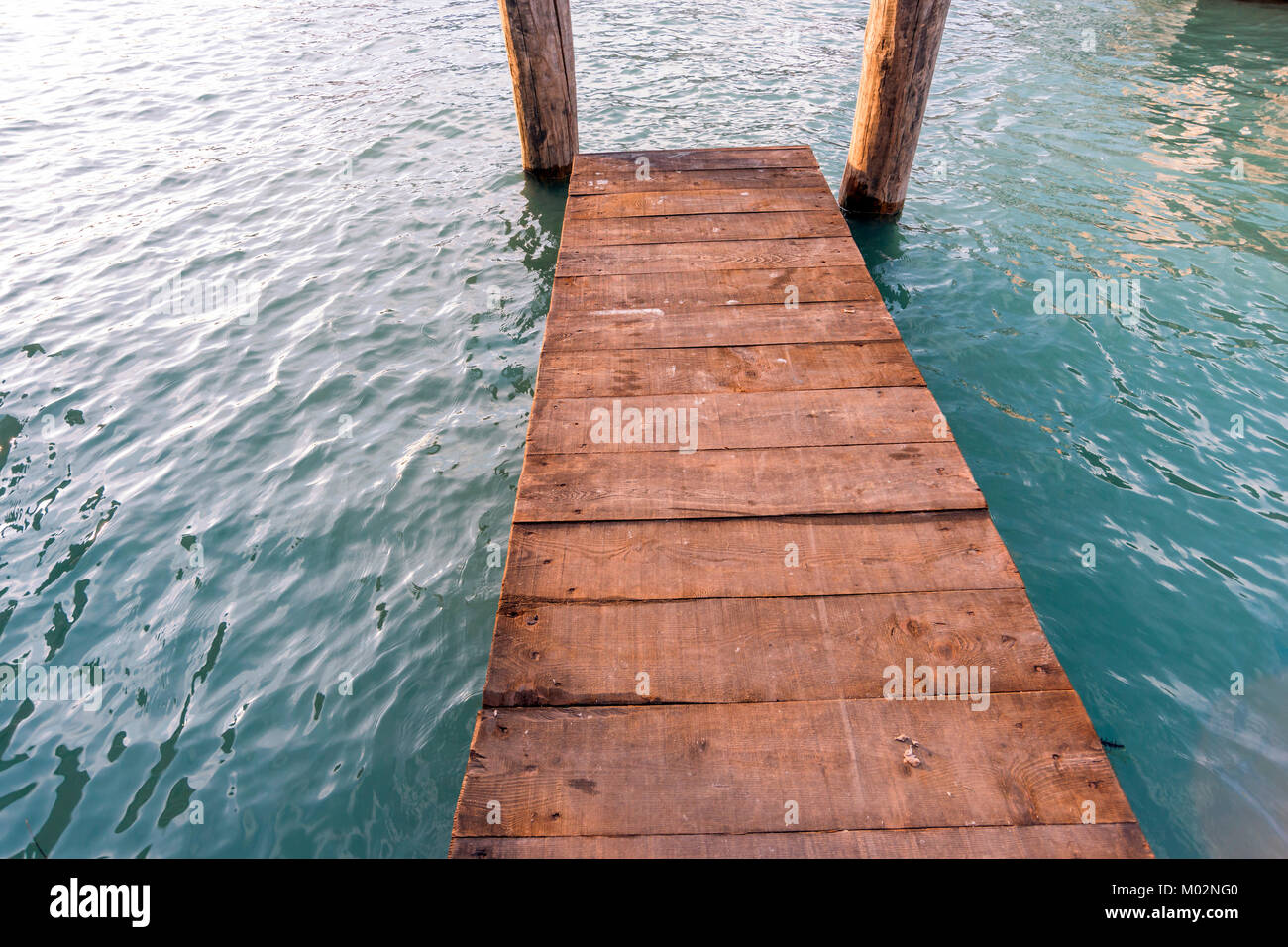 wooden boat pier in Venice, Italy by sunny morning Stock Photo - Alamy