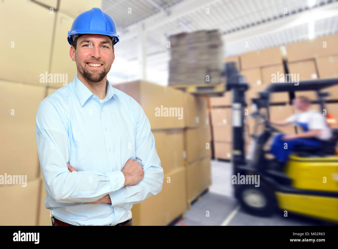 manager works on-site in the warehouse of an industrial company Stock ...