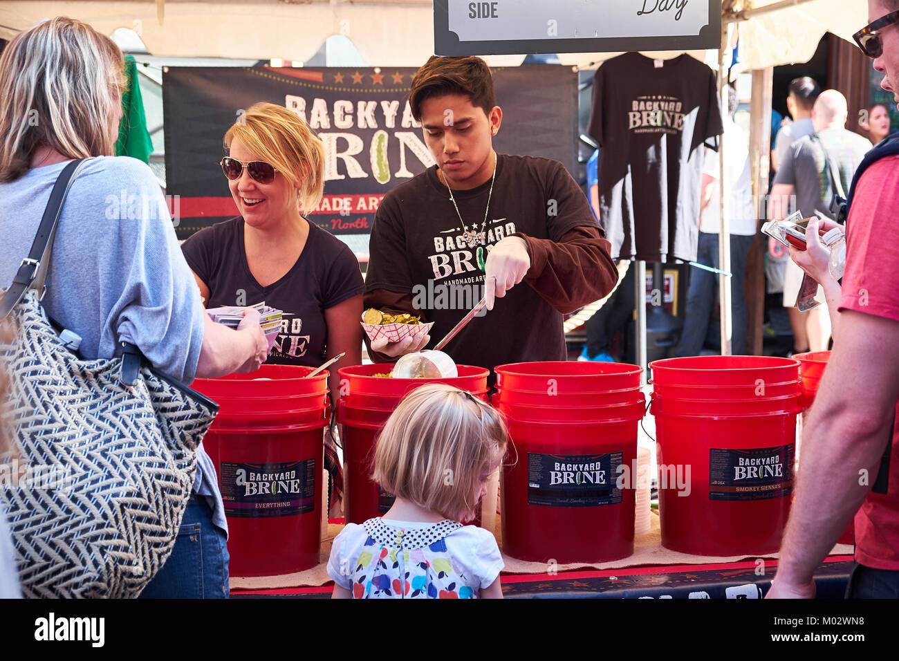 NEW YORK CITY - SEPTEMBER 25, 2016: Handing out pickles to visitors at ...