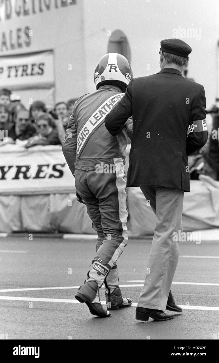 Marshalls assistTony Rutter after he fell from his Ducati at ...