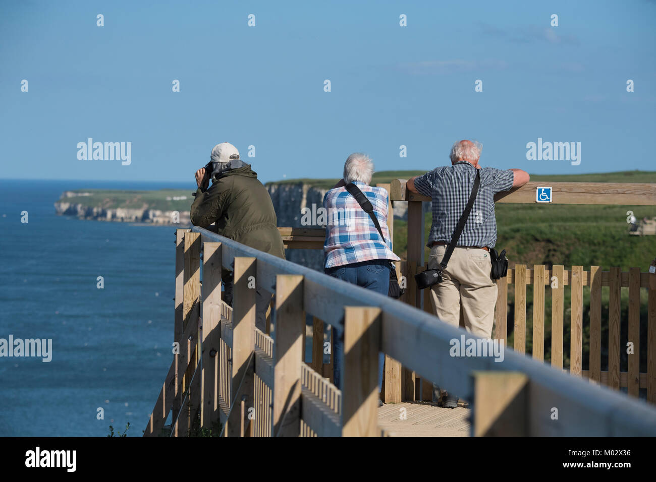 Woman standing on cliffside viewpoint hi-res stock photography and ...