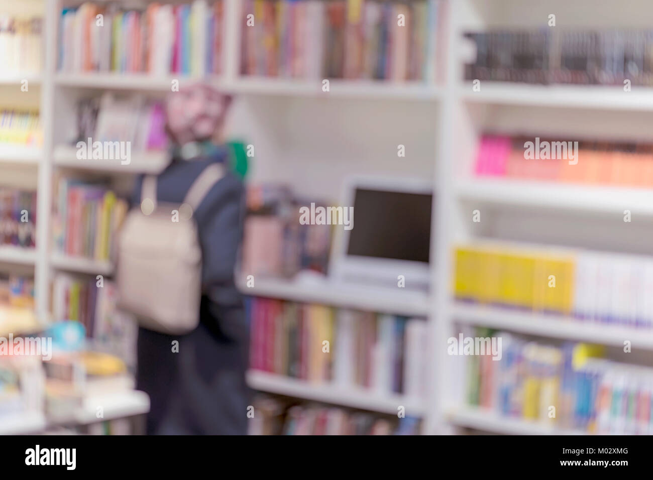 Girl in modern bookstore. Lot of interesting books. Education, school ...