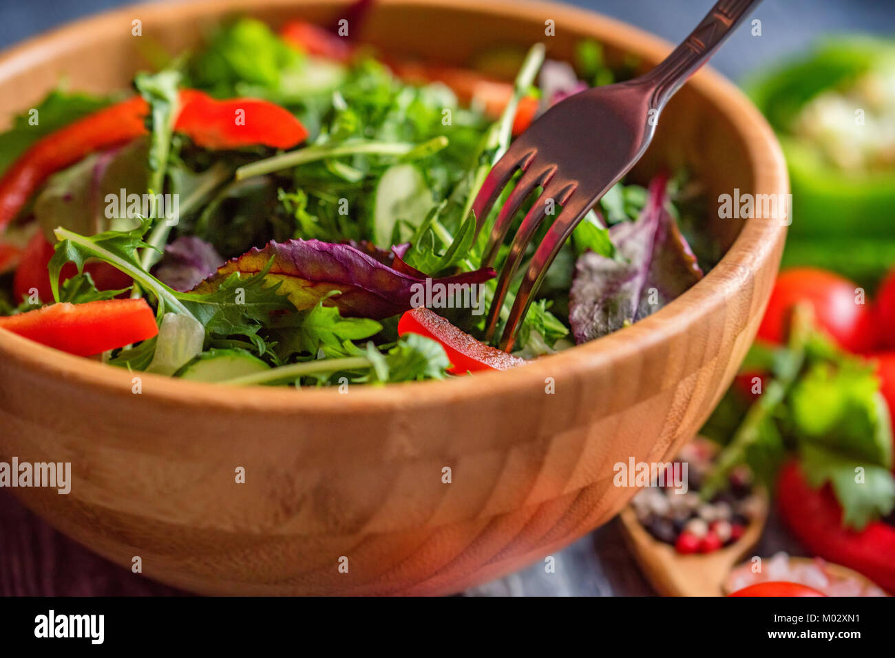 Fresh rustic vegetable salad on rustic background Stock Photo - Alamy