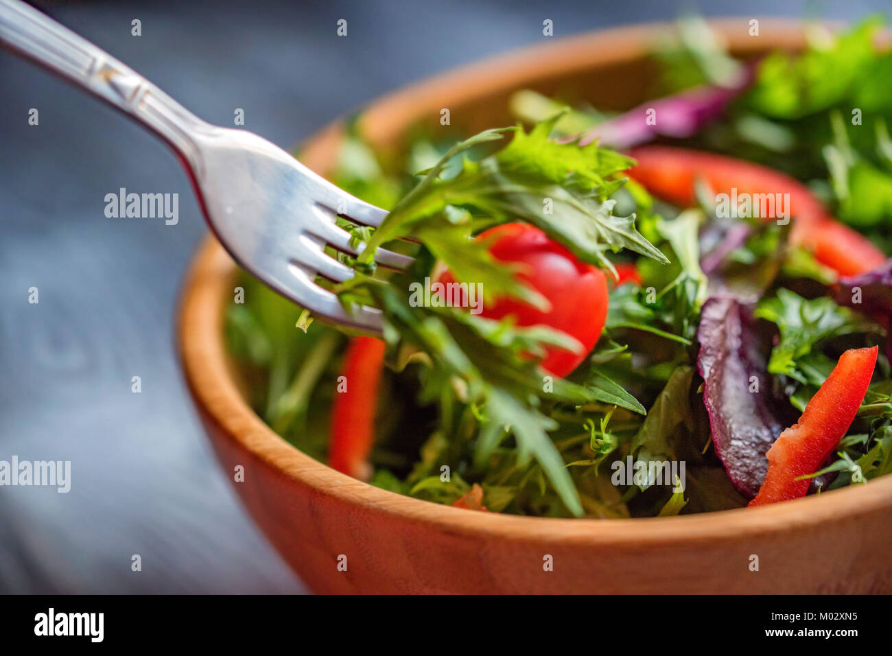 Fresh rustic vegetable salad on rustic background Stock Photo - Alamy