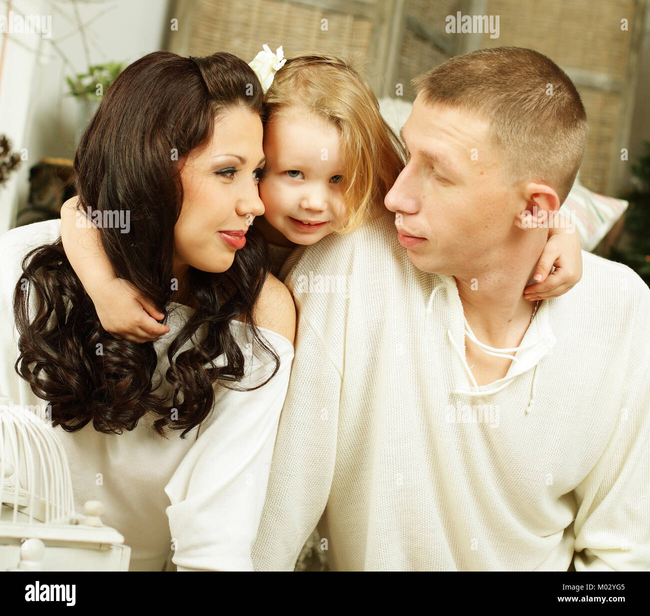 Family - cute child and loving parents Stock Photo - Alamy