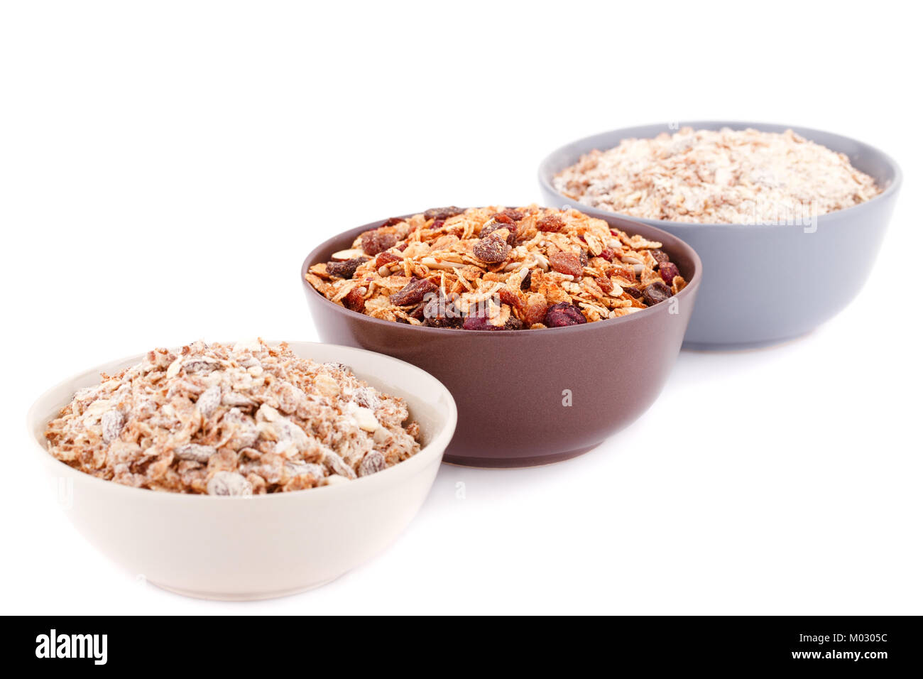 Musli in the bowl isolated on white background Stock Photo - Alamy