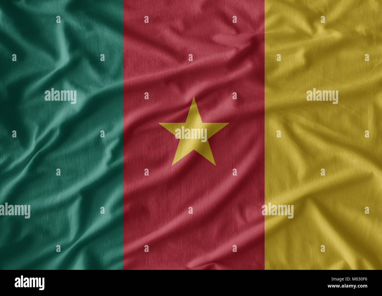 Cameroon flag pattern on the fabric texture Stock Photo - Alamy