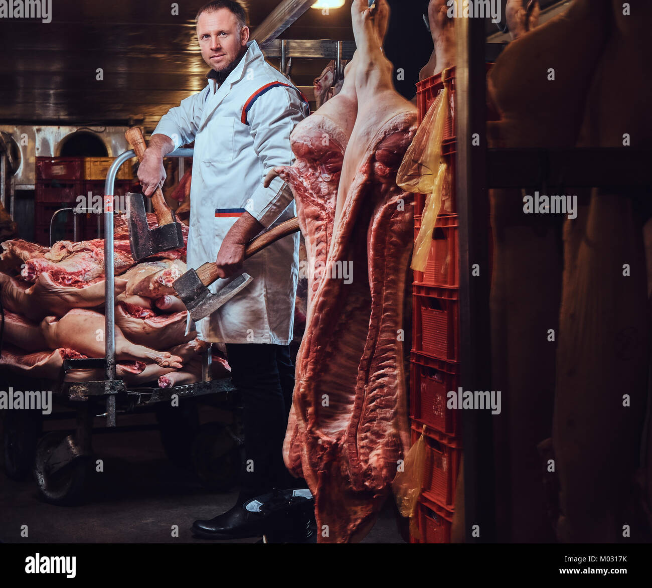 A butcher in a meat factory Stock Photo - Alamy