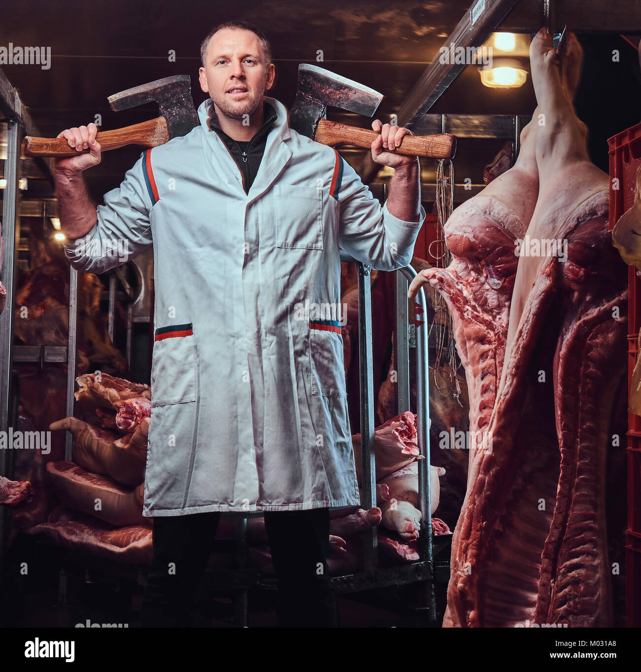 The butcher in a meat factory Stock Photo - Alamy