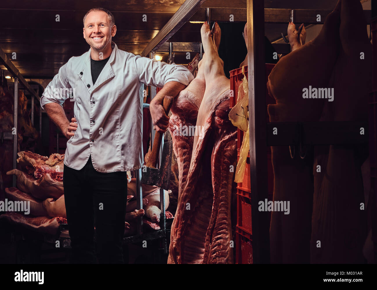 The butcher in a meat factory Stock Photo - Alamy