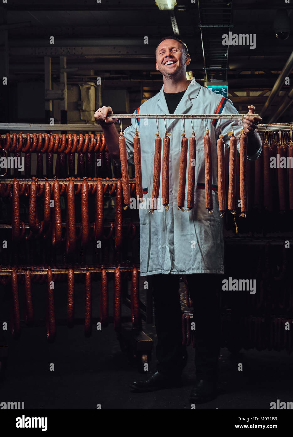A man in sausage storage Stock Photo - Alamy