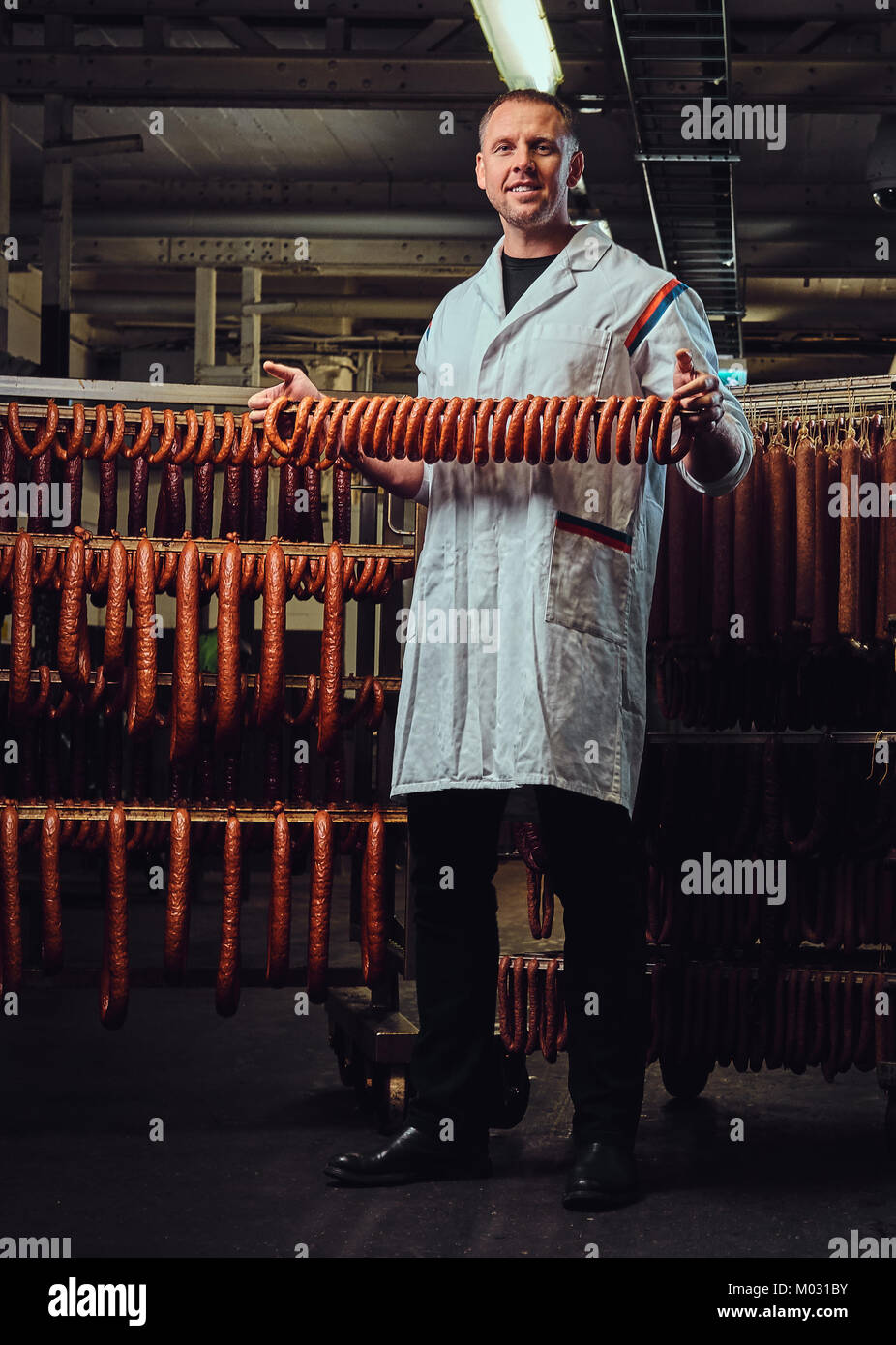 A man in sausage storage Stock Photo - Alamy