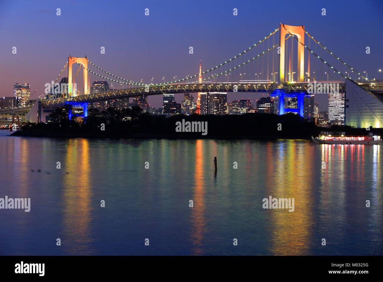 Rainbow Bridge in Tokyo, Japan. Night city view with Shibaura district ...