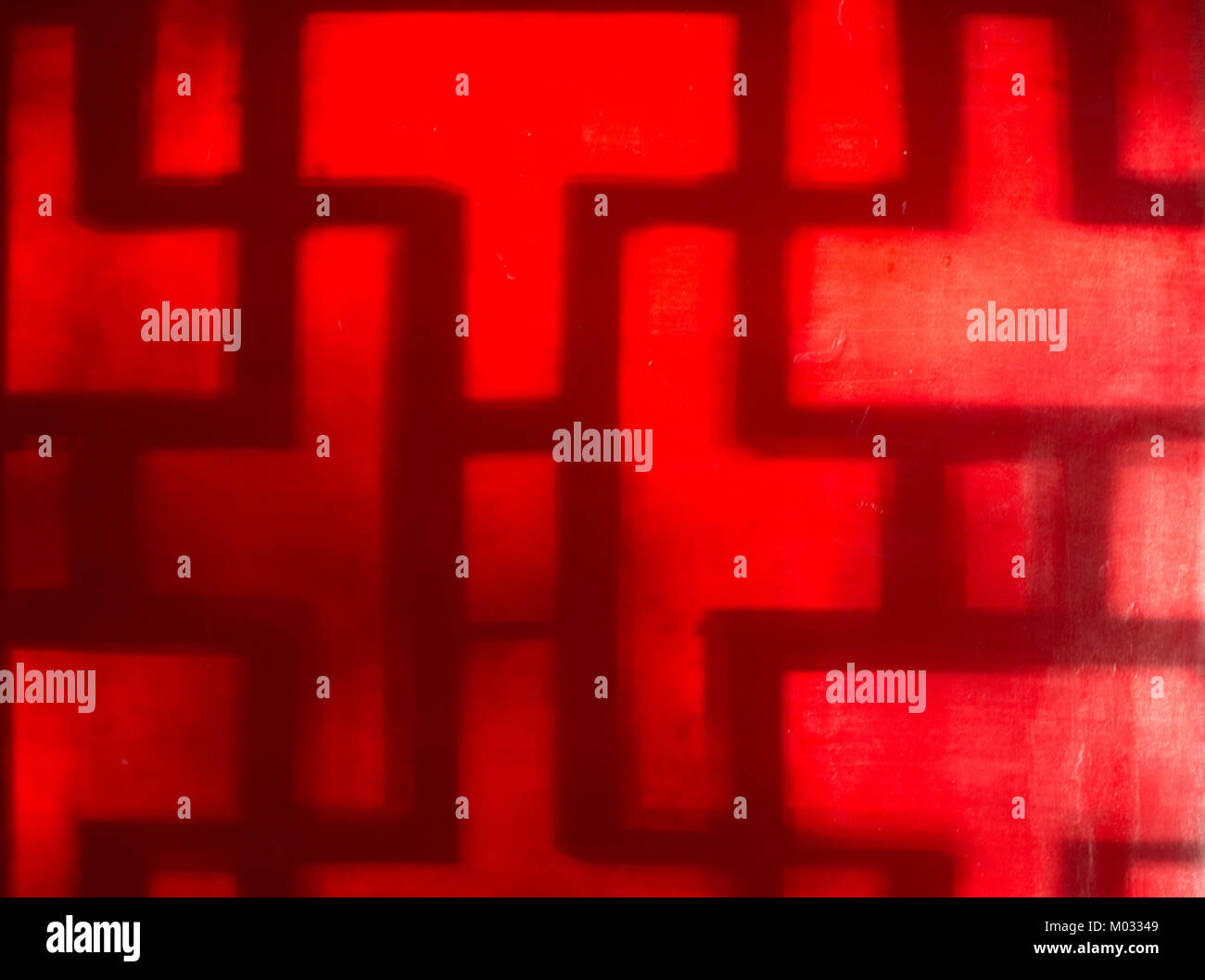 The sunlight shines through the lattice window on the red wood, the ...