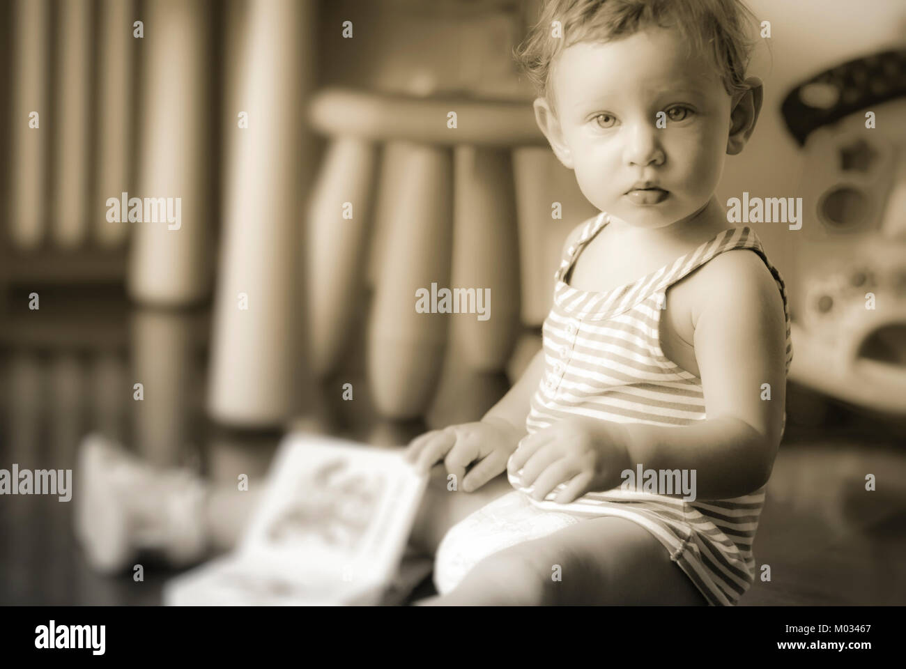 Little child reading a book Stock Photo - Alamy