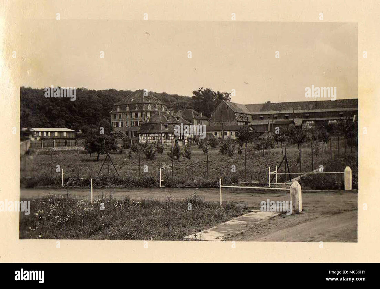 This photograph captures an old farm, reflecting the rural life and ...