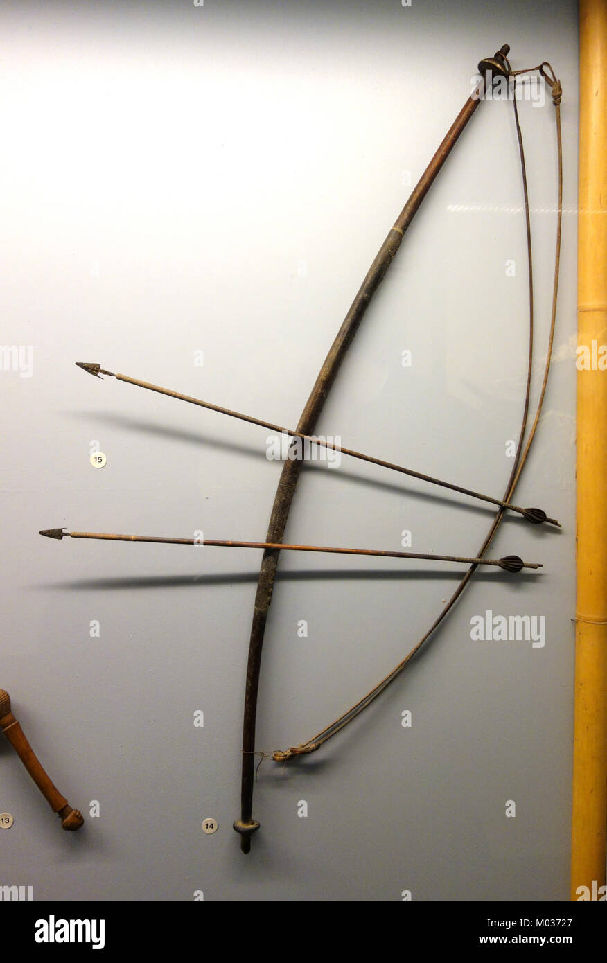 A photograph of a bow and arrows from the Luba people, displayed at the ...