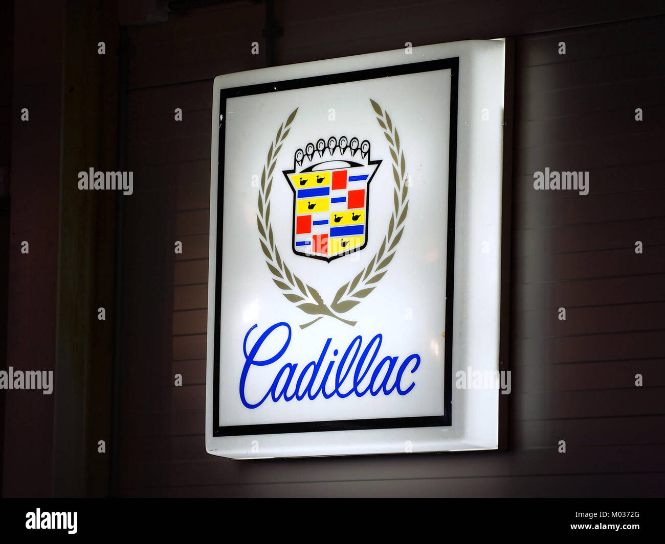 This image shows a vintage Cadillac light advertisement, highlighting ...