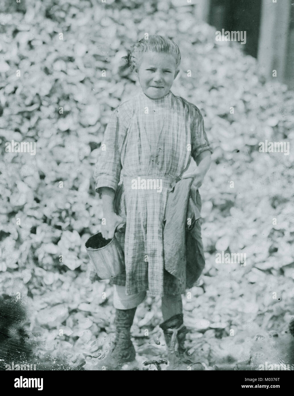 Tiny, seven year old oyster shucker (Henry's sister, No. 3291) does not ...