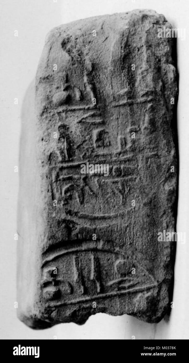 This brick features a stamp with the name and titles of a historical ...