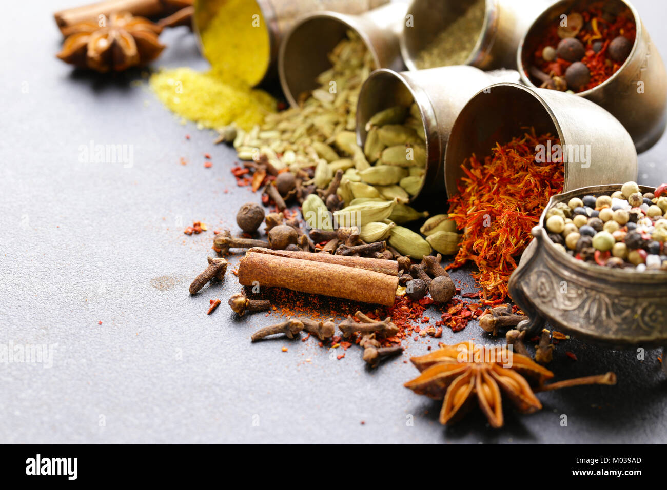 various aromatic spices in metal vintage bowls Stock Photo - Alamy