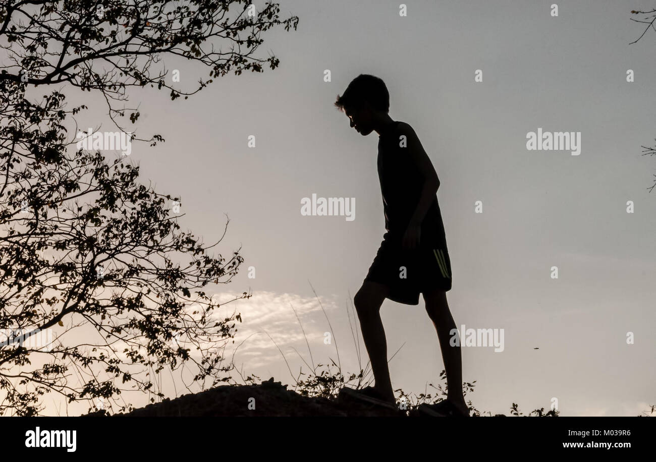 Boy casting a shadow hi-res stock photography and images - Alamy