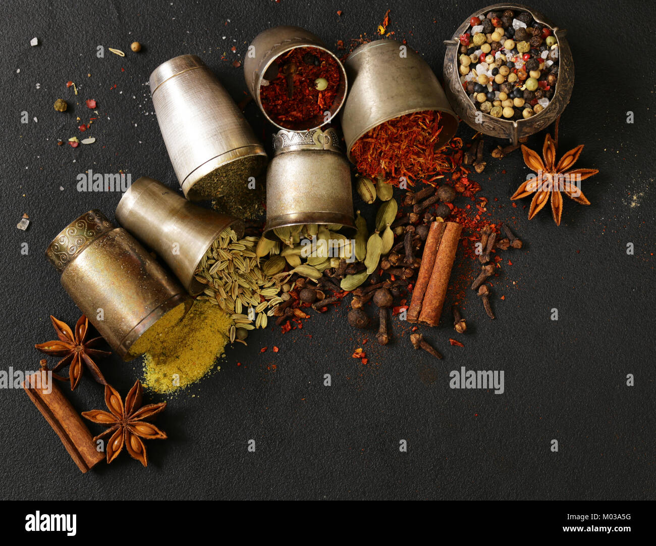 various aromatic spices in metal vintage bowls Stock Photo - Alamy