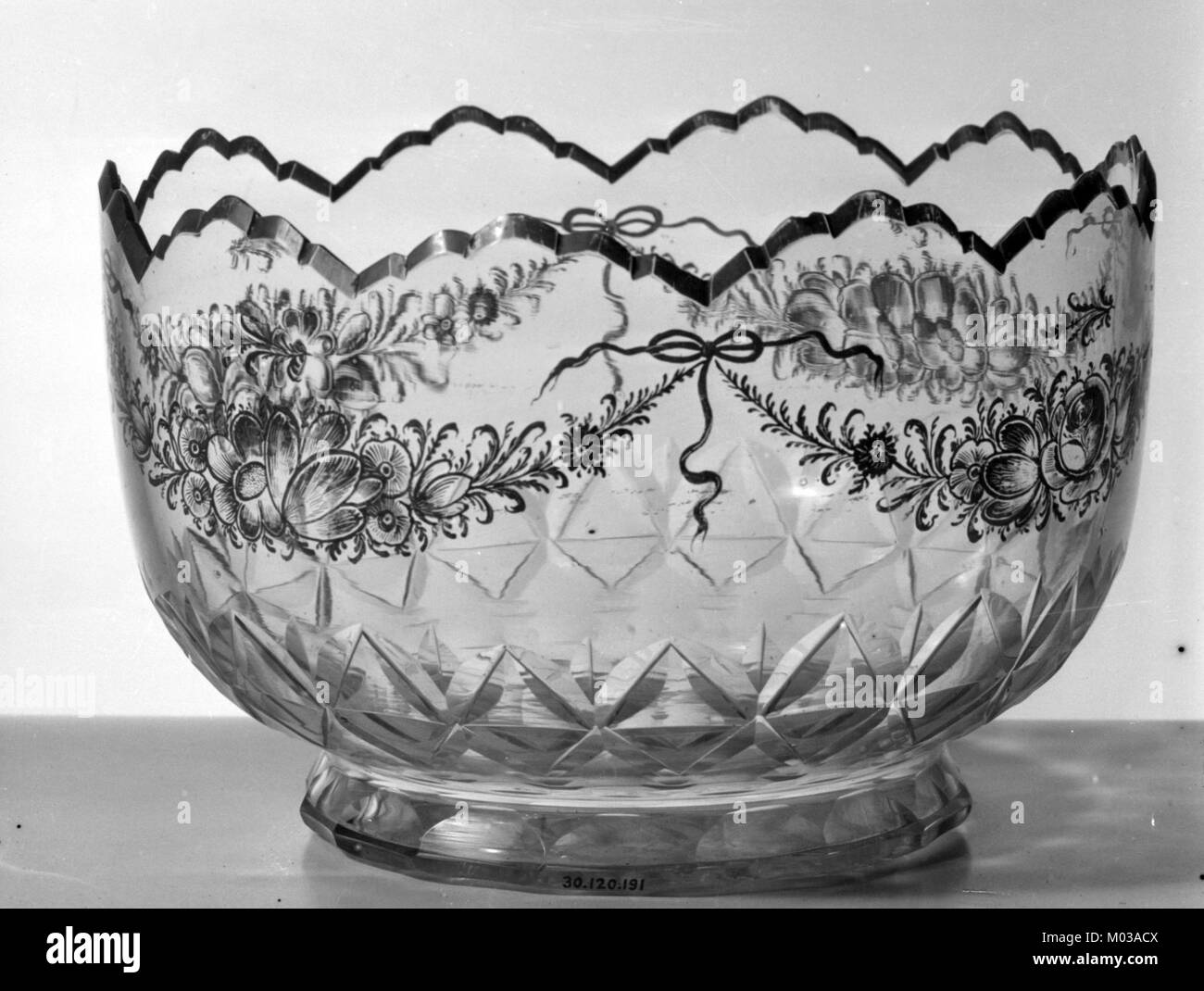 This gilded bronze bowl, part of a pair, features intricate designs and ...