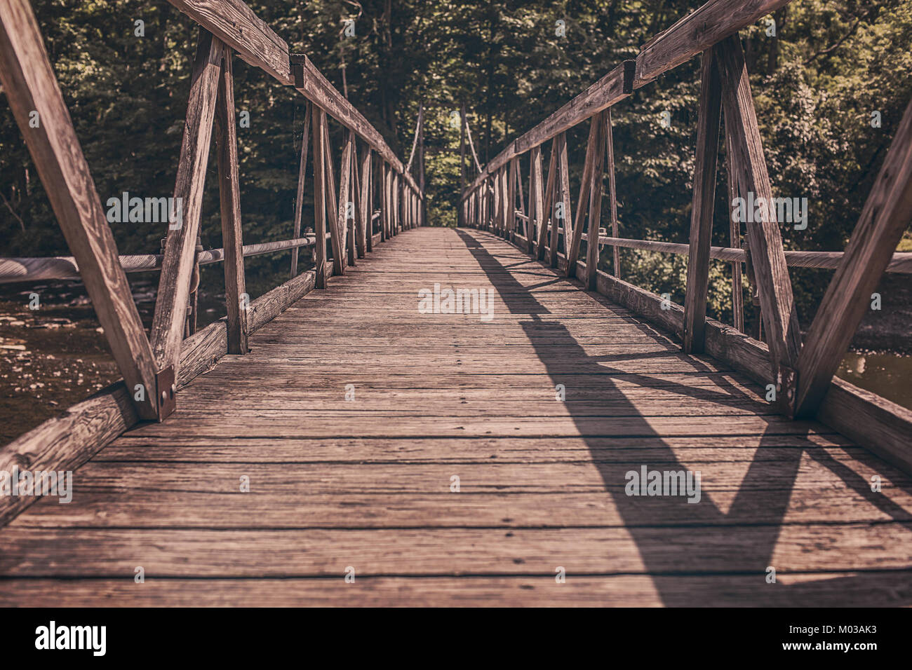 A straight wooden bridge path, showcasing a simple and functional ...