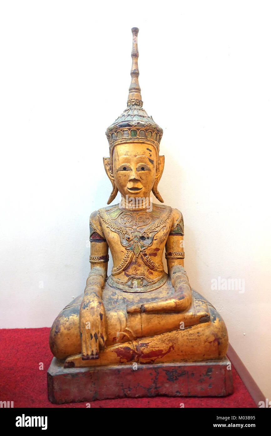 This wooden Buddha statue, created by the Khmer people, is housed at ...