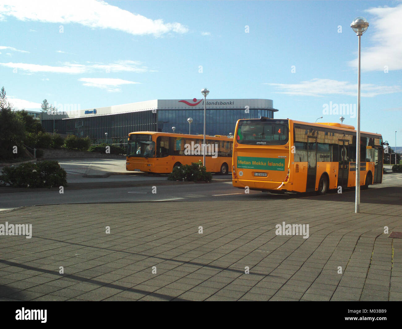 The image depicts buses operating in Kopavogur, Iceland. The buses are ...