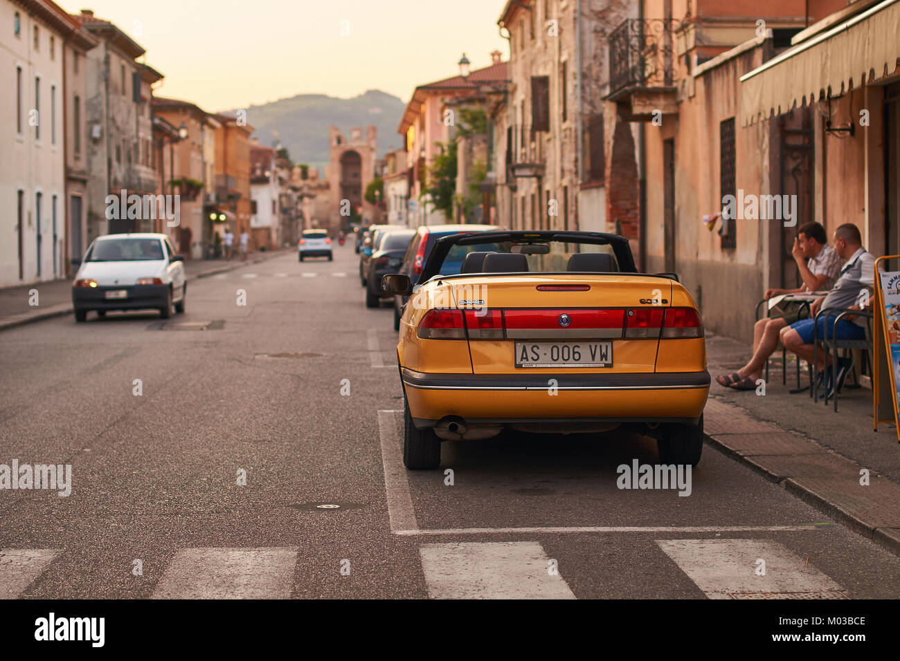 Yellow SAAB 900S cabriolet car parked on the street of Soave, Italy ...
