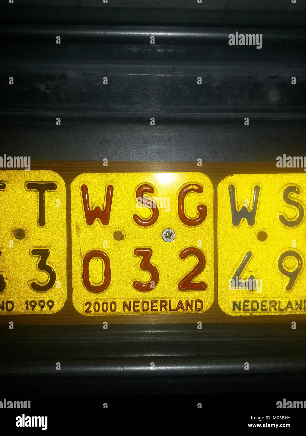 A bromfietsplaatje, issued in the year 2000, refers to a license plate ...