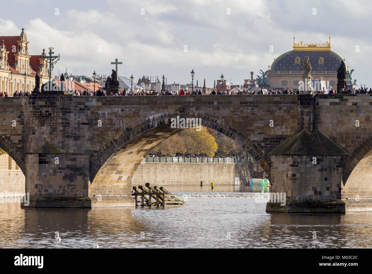 The famous Charles Bridge and the Vltava river in Prague on an autumn ...