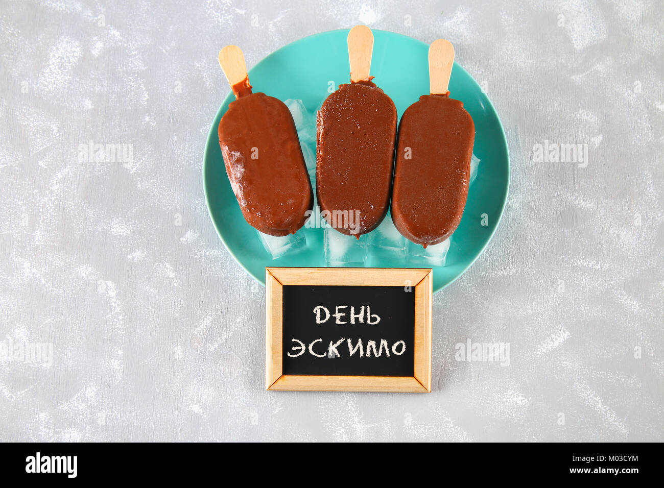 Ice cream eskimo pie on a stick with the text in Russian - Day eskimo ...