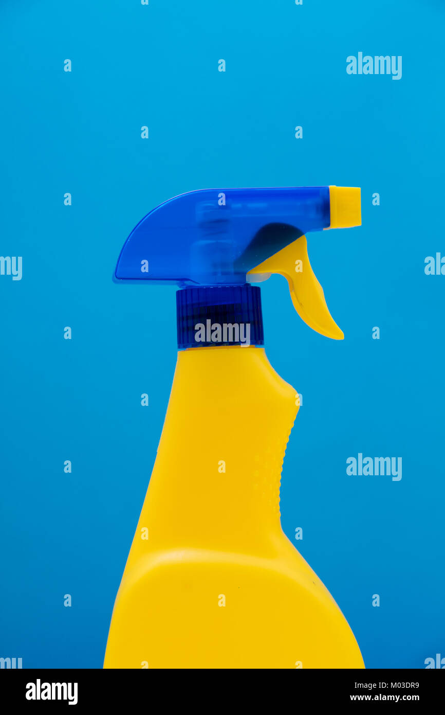 Cleaning spray bottle products on a bright blue background Stock Photo ...