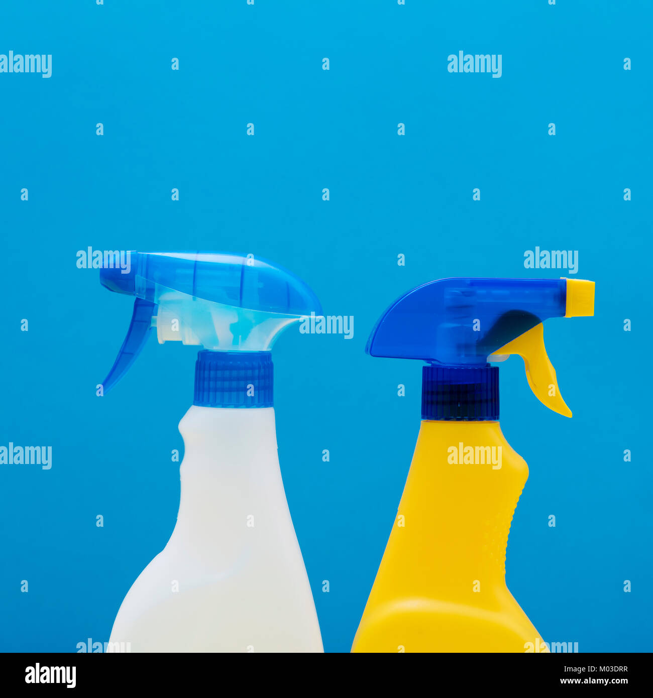 Cleaning spray bottle products on a bright blue background Stock Photo ...