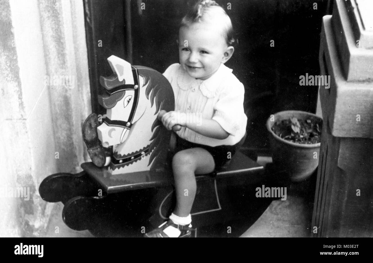 child on rocking horse Stock Photo - Alamy