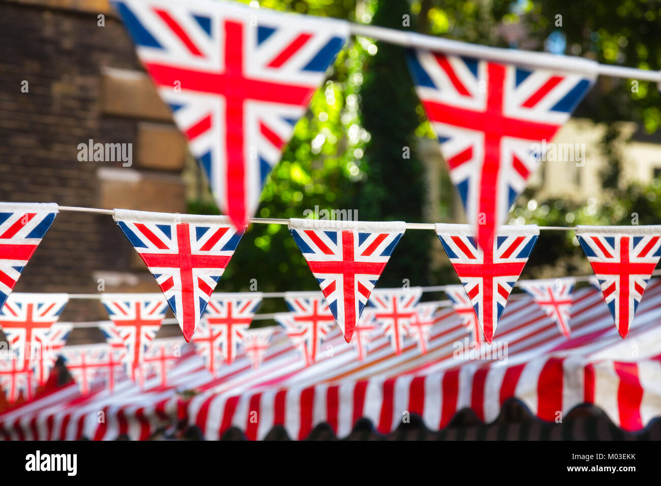 Union Jack flag triangular bunting hanging in a street, a festive ...