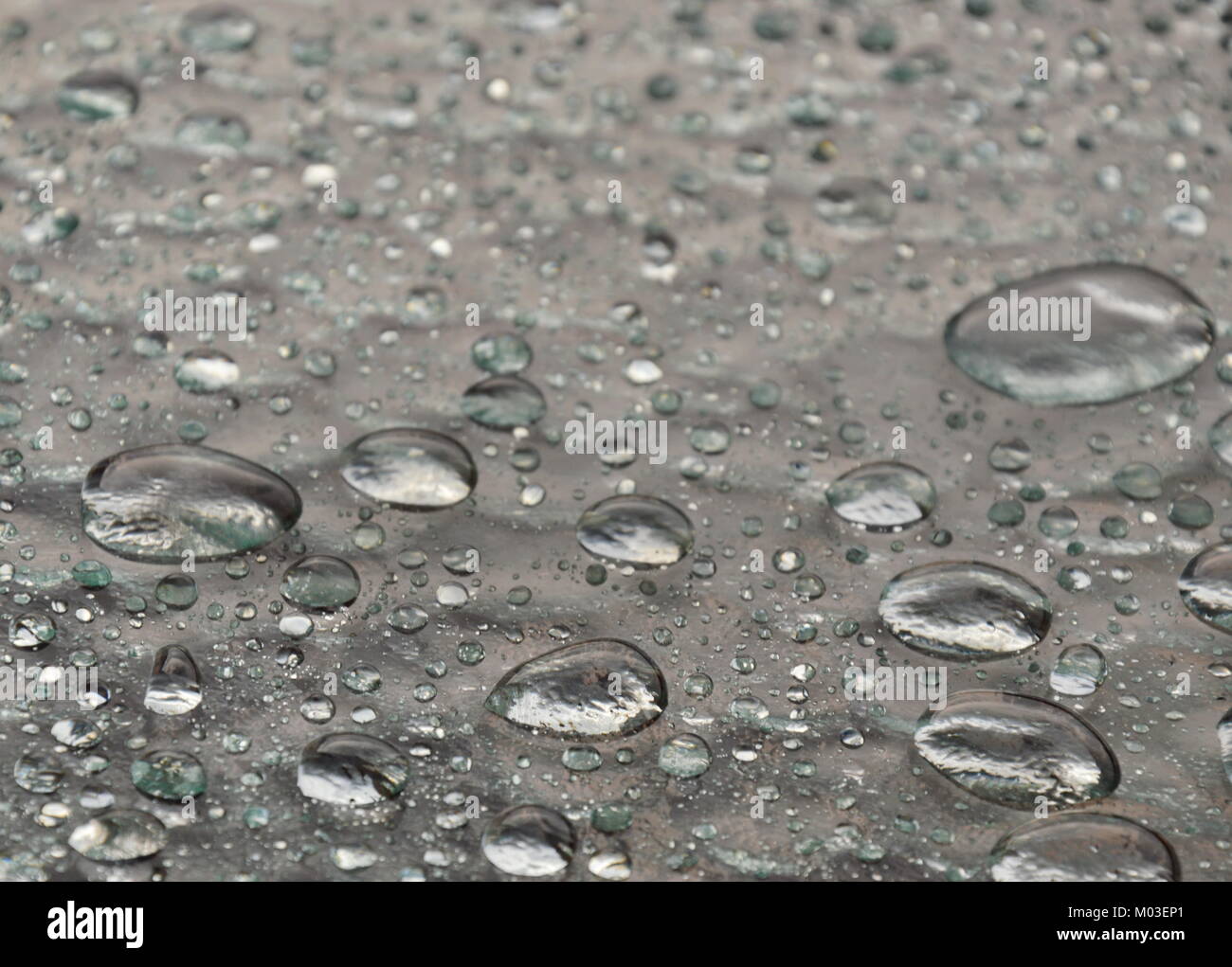 drop of water on glass table Stock Photo - Alamy