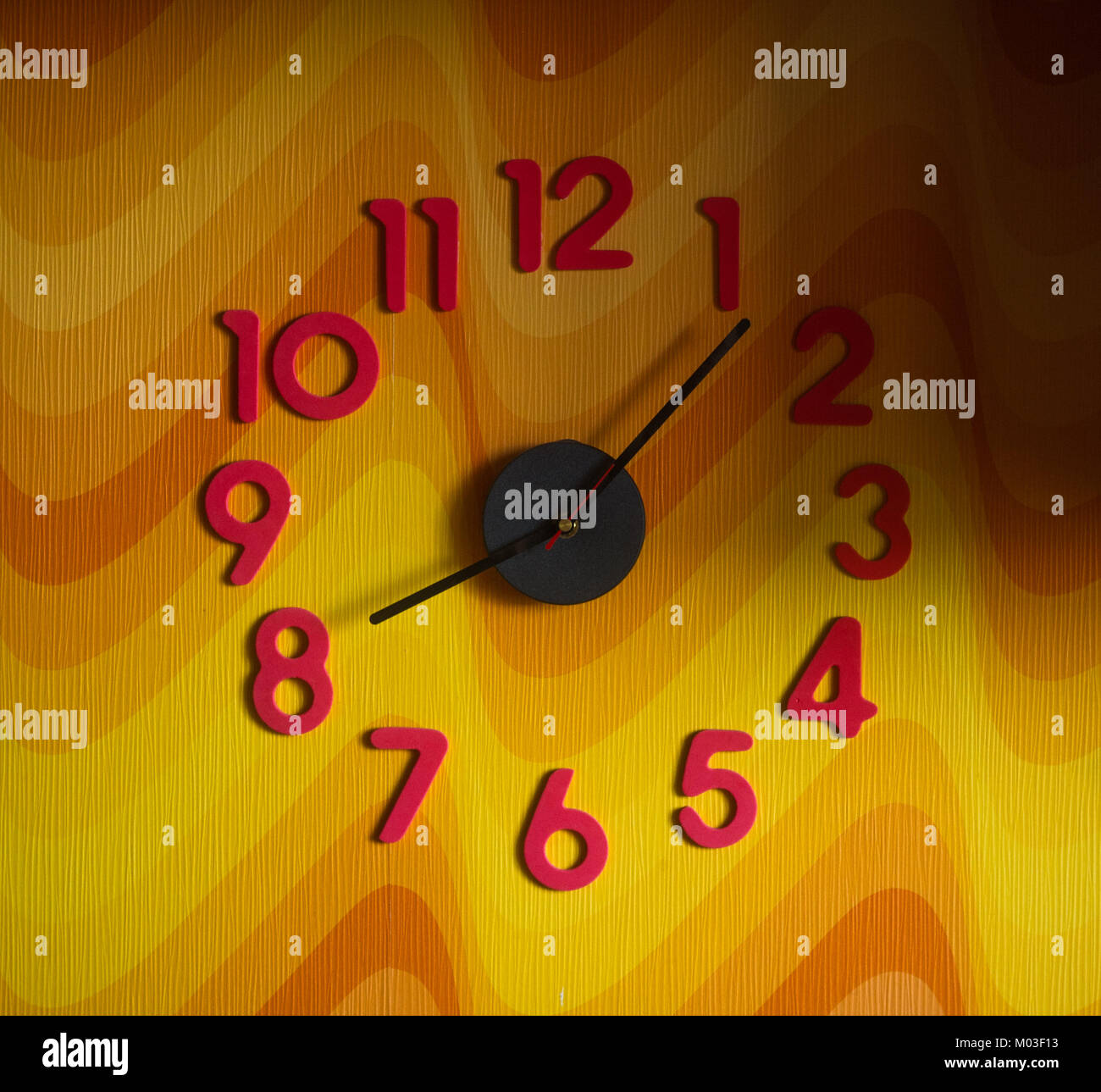 large wall clock with colorful numbers, close up Stock Photo - Alamy