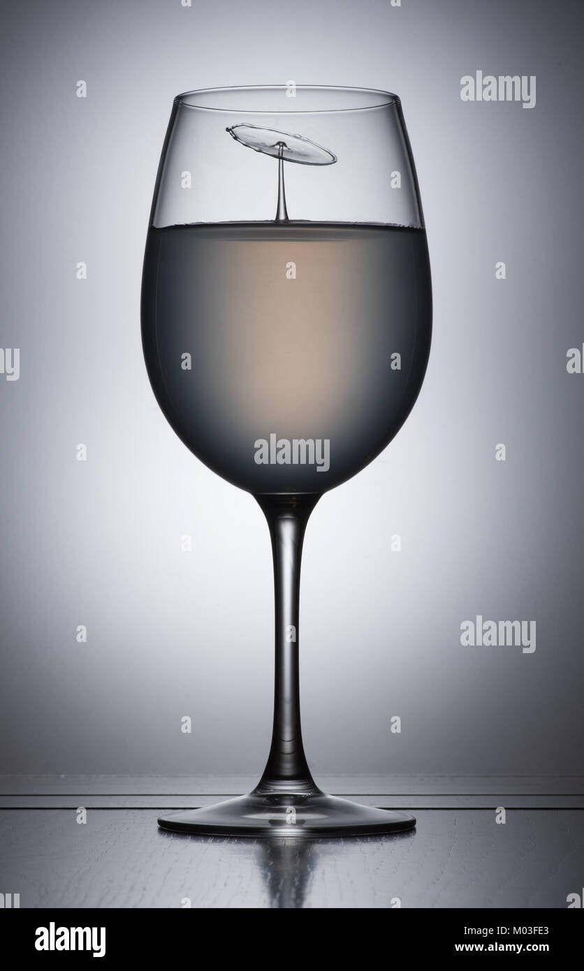 Water Droplet splash in a glass Stock Photo - Alamy