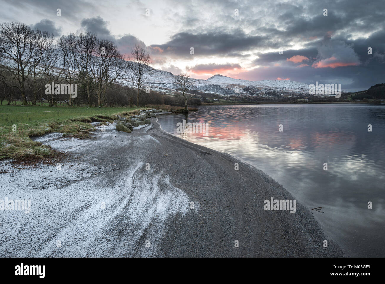 Beautiful sunrise landscape image in Winter of Llyn Cwellyn in ...