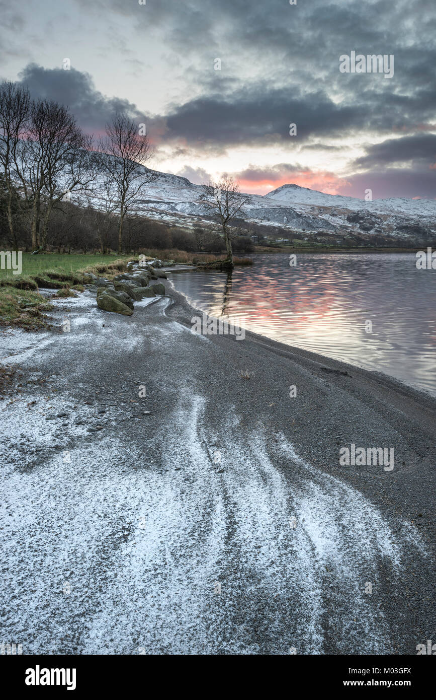 Beautiful sunrise landscape image in Winter of Llyn Cwellyn in ...