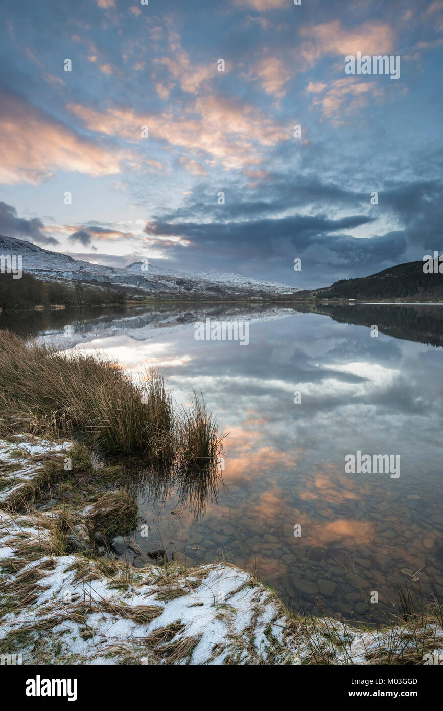 Beautiful sunrise landscape image in Winter of Llyn Cwellyn in ...