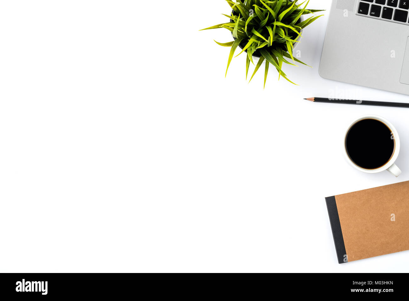 Office desktop with modern laptop on white background. Top view Stock ...