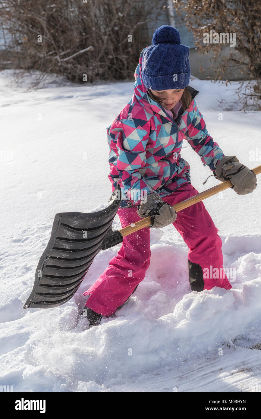 Child shoveling snow hi-res stock photography and images - Alamy