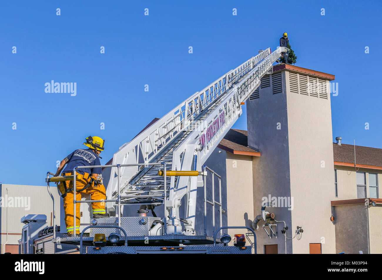 Firefighter Kevin Martin uses the ladder on the 105 foot Aerial fire ...