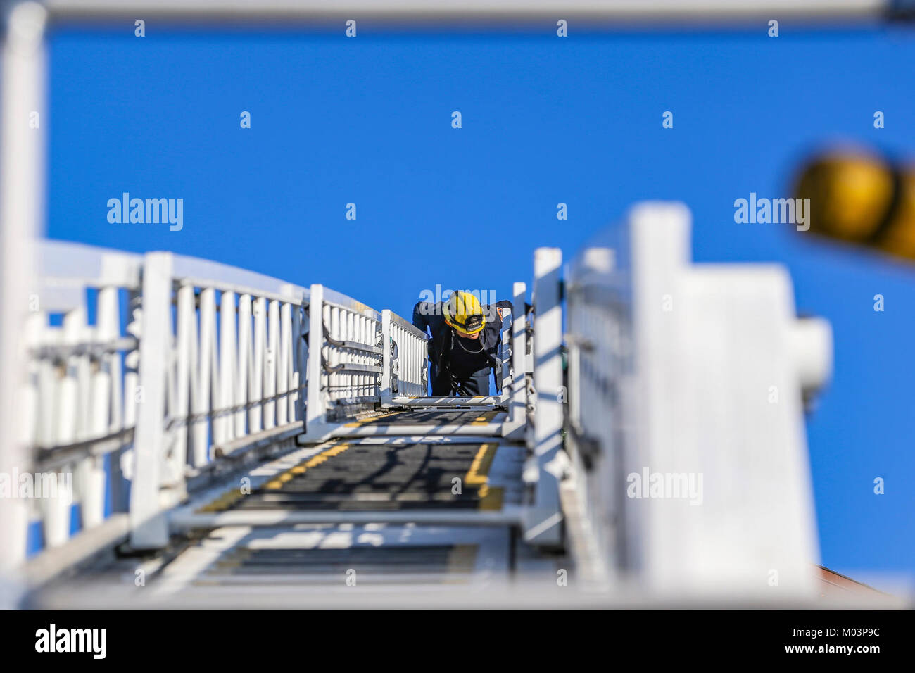 Firefighter Kevin Martin uses the ladder on the 105 foot aerial fire ...