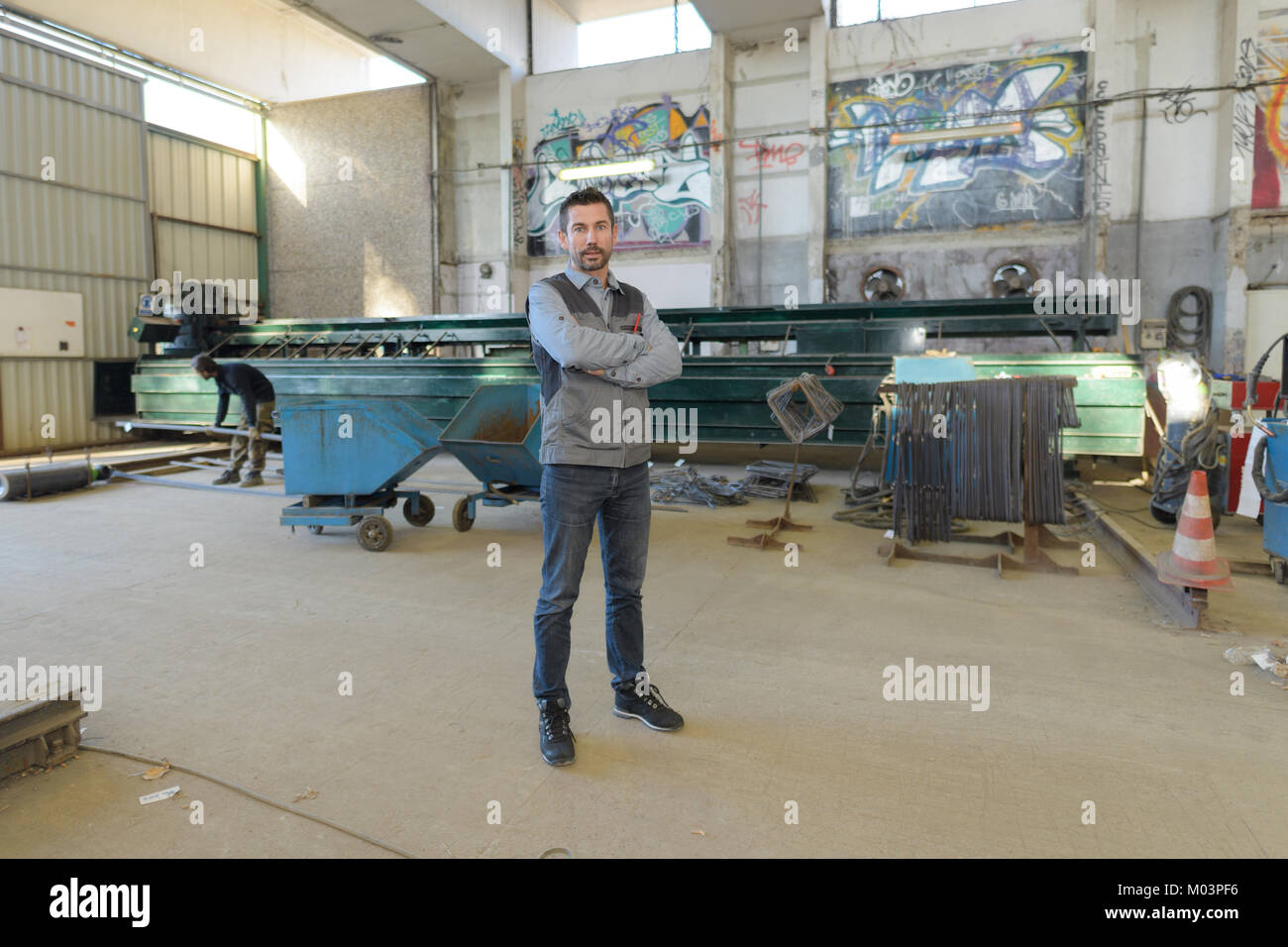 Portrait of man in factory workshop Stock Photo - Alamy